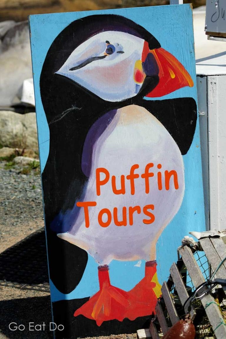 A sign for puffin viewing tours in Nova Scotia. | Go Eat Do
