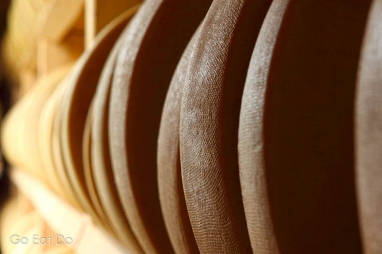 Wheels of mountain cheese ripening at La Maison de L’Etivaz in Etivaz ...