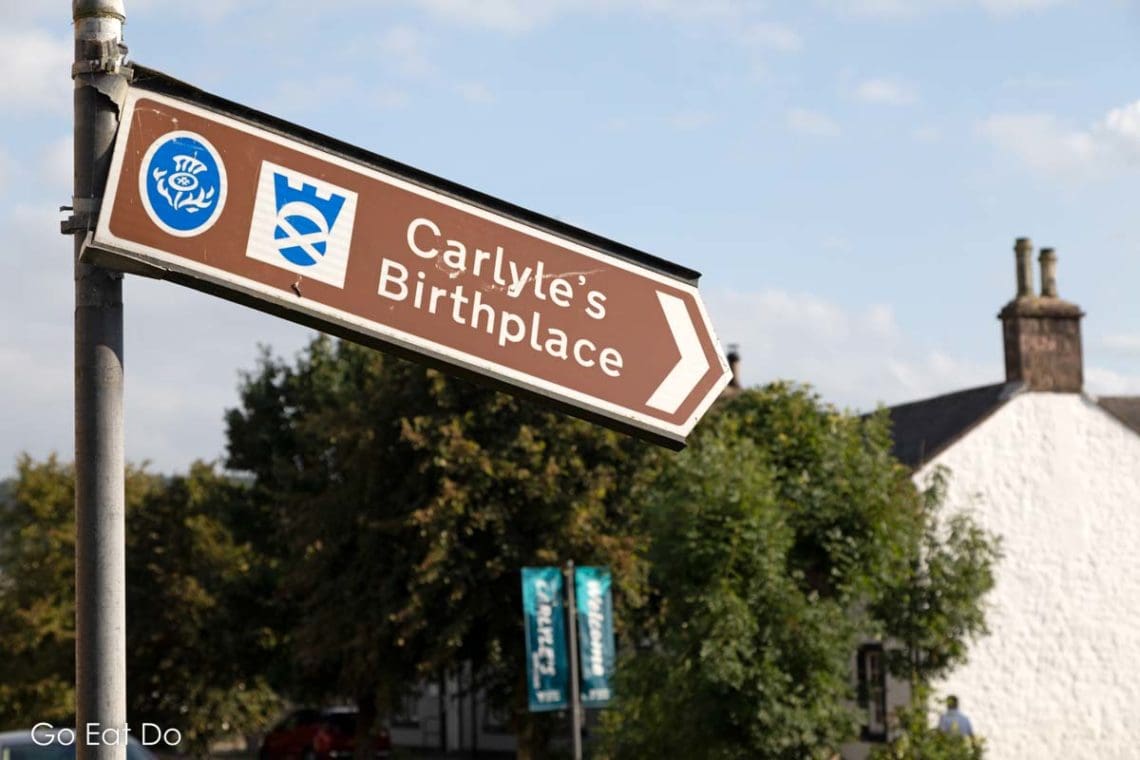 Sign pointing to the National Trust for Scotland managed cottage that ...